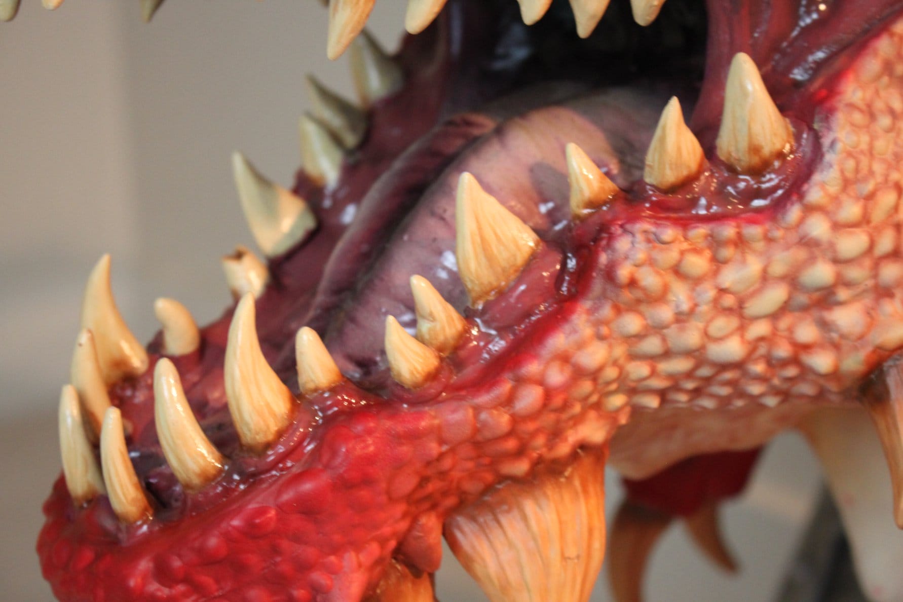 The majestic restoration of this red dragon's mounted head