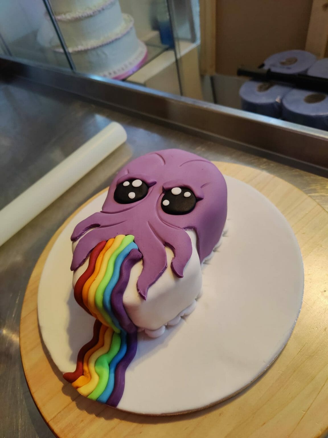 A mind flayer vomiting a rainbow cake generator