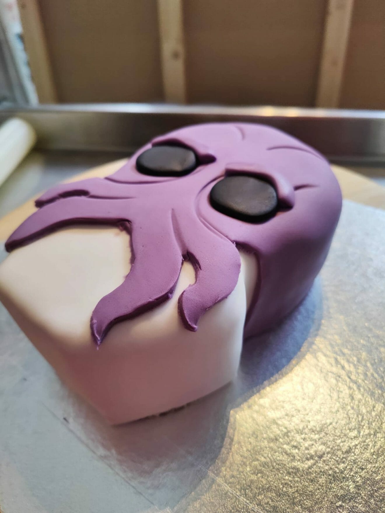 A mind flayer vomiting a rainbow cake generator