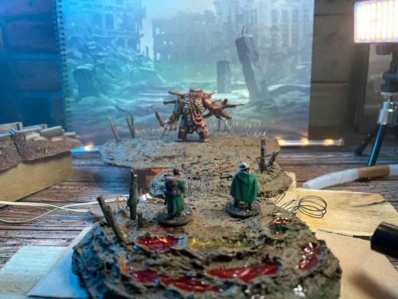 Handiwork Games brings grimdark Trench Crusade photo backdrops to Kickstarter